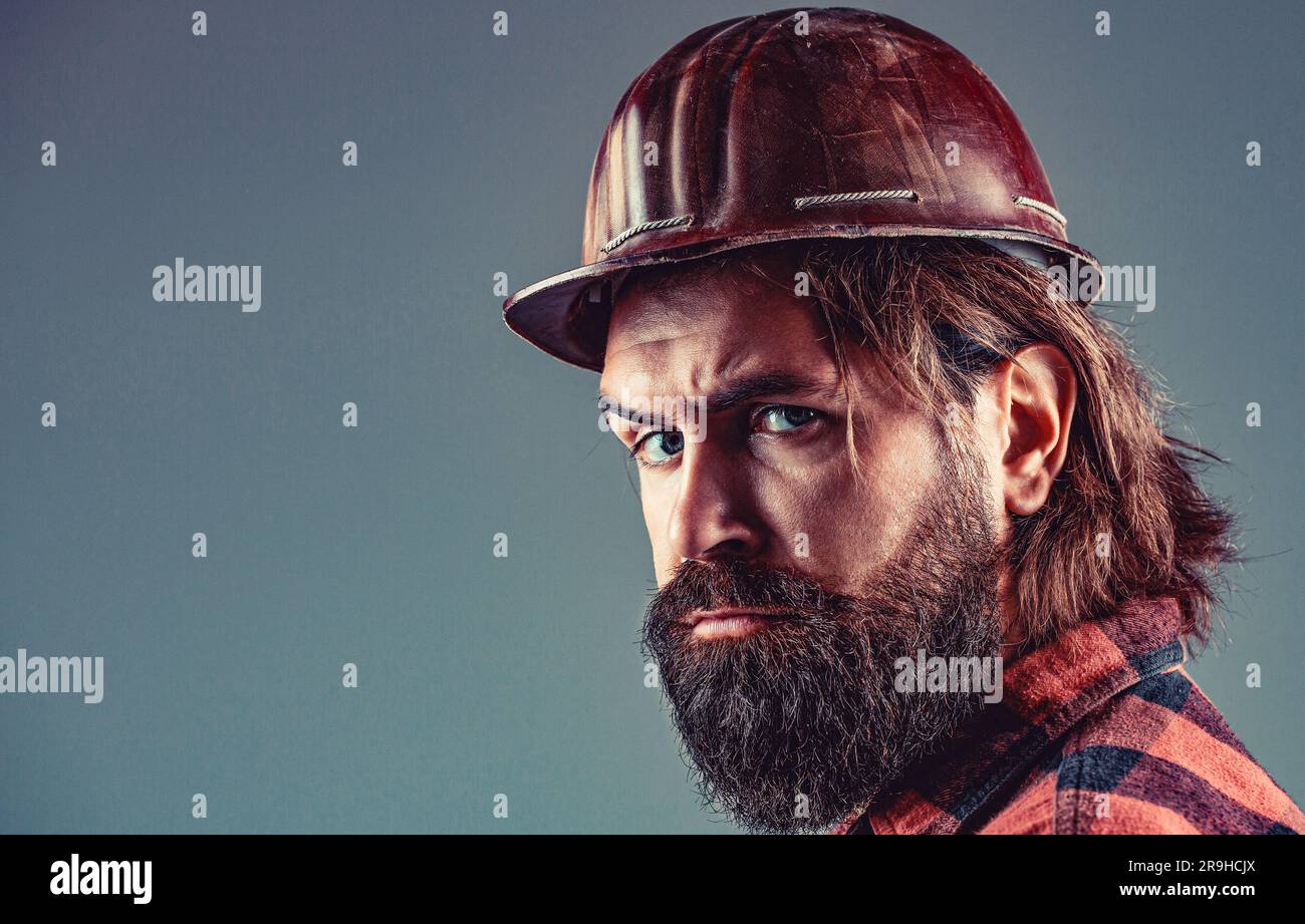 Bearded man worker with beard in building helmet or hard hat. Man ...