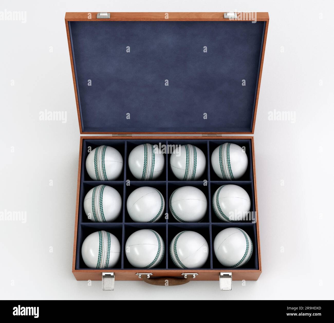 Twelve generic white cricket balls in a wooden display box lined with ...