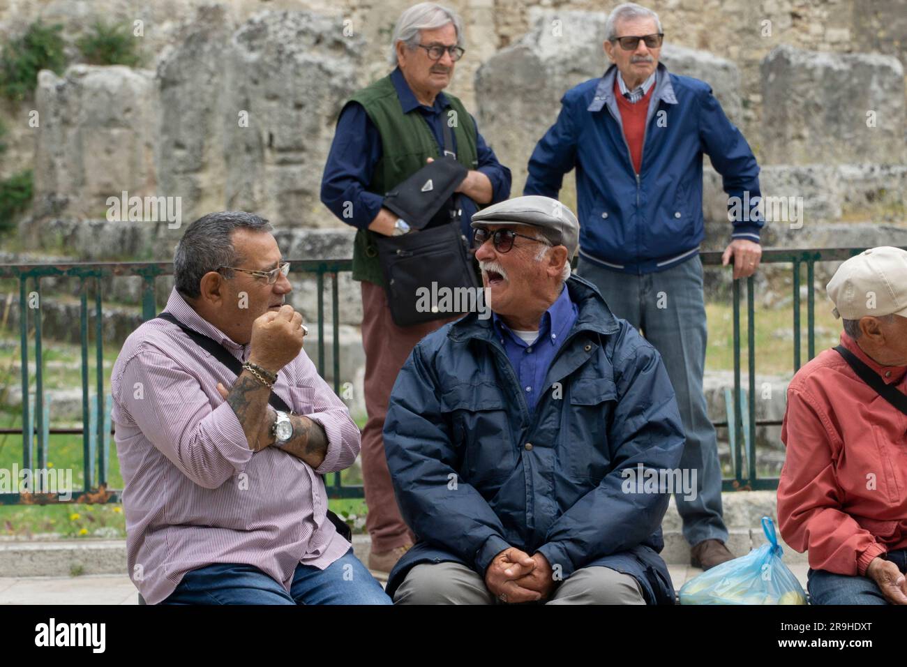 Group of old men in conversation ortigia island sicily Stock Photo - Alamy