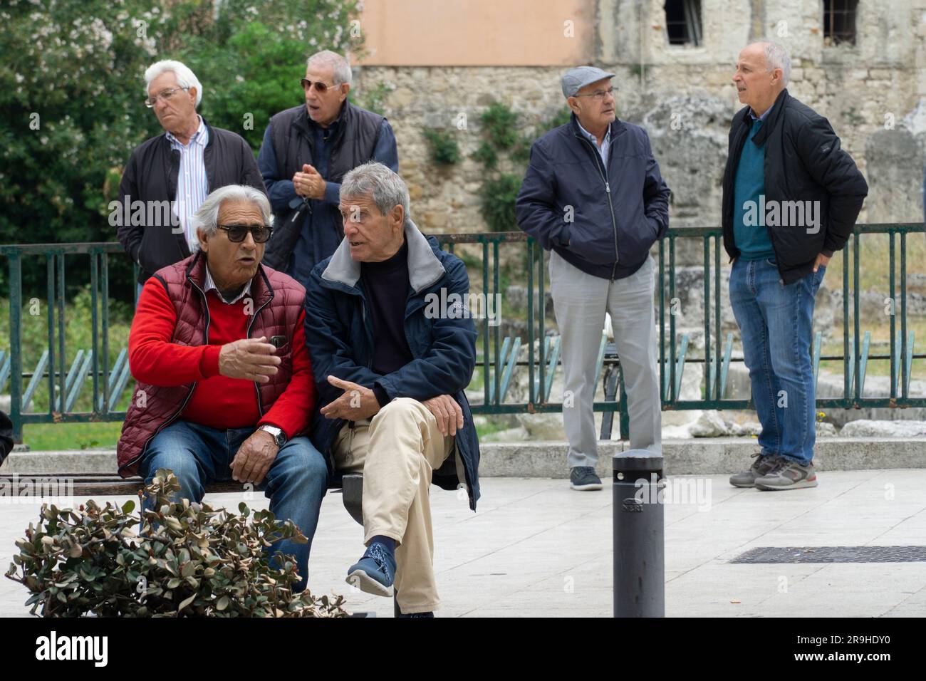 Group of old men in conversation ortigia island sicily Stock Photo - Alamy