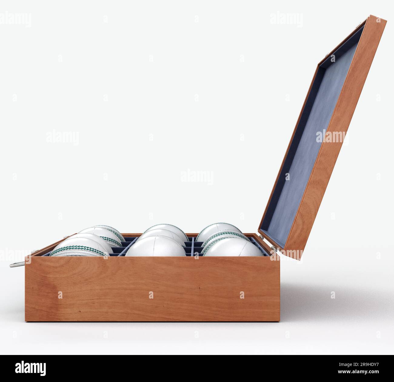 Twelve generic white cricket balls in a wooden display box lined with ...