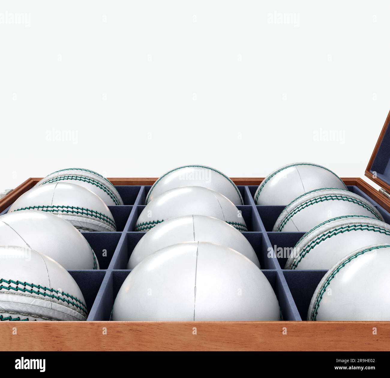 Twelve generic white cricket balls in a wooden display box lined with ...