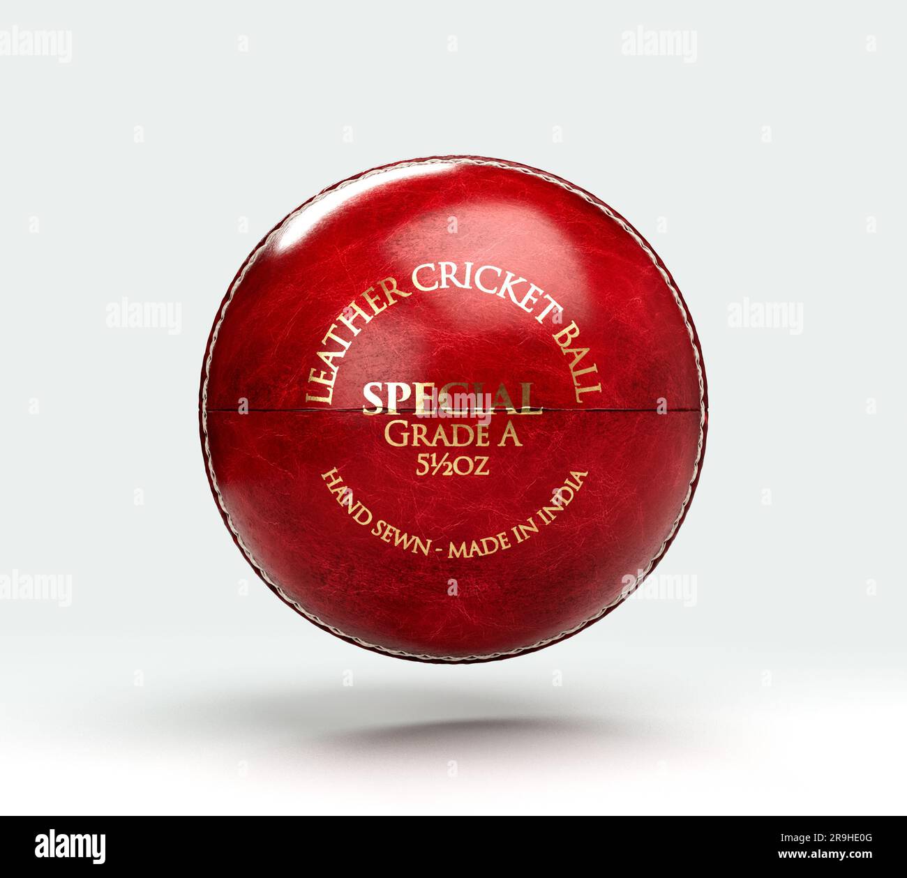 A regular red cricket ball with white stitching and generic gold ...