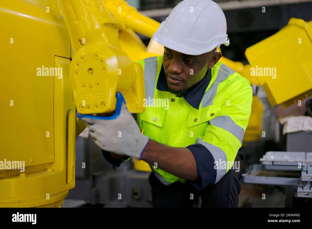 Engineer work at robotic arm factory. Technology and engineering ...