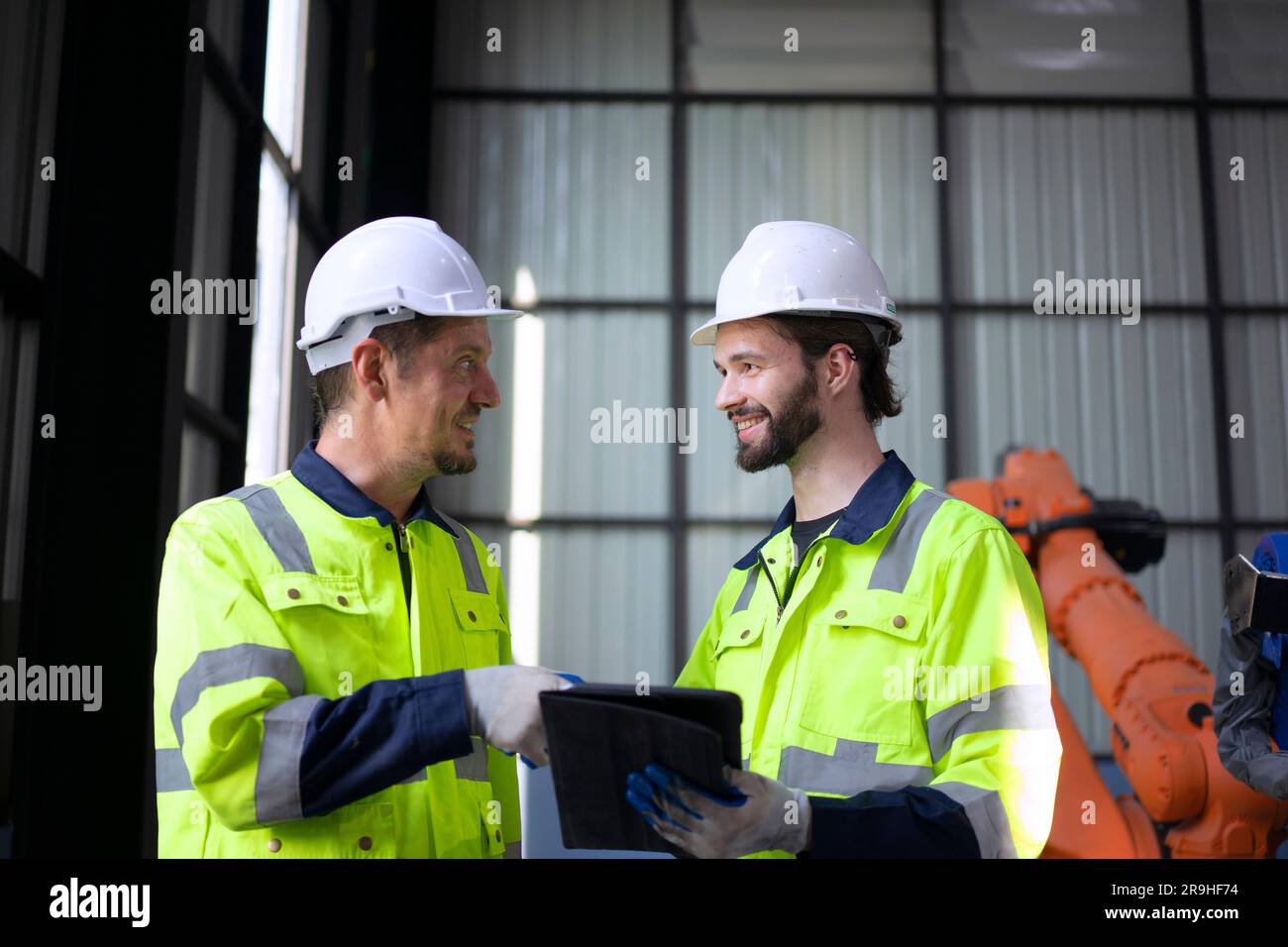 Engineer work at robotic arm factory. Technology and engineering ...