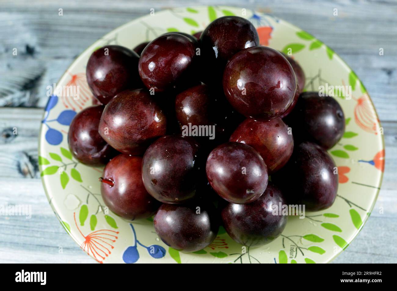 pile of plum fruit, A fruit of some species in Prunus subg. Prunus ...