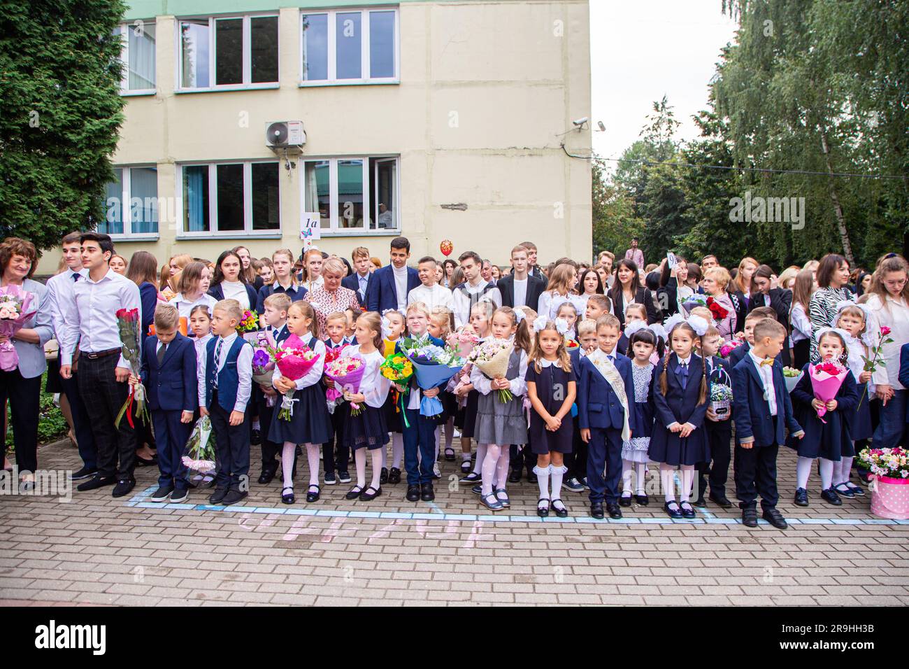 Meeting with the first-grade pupils and teacher at schoolyard. The day ...