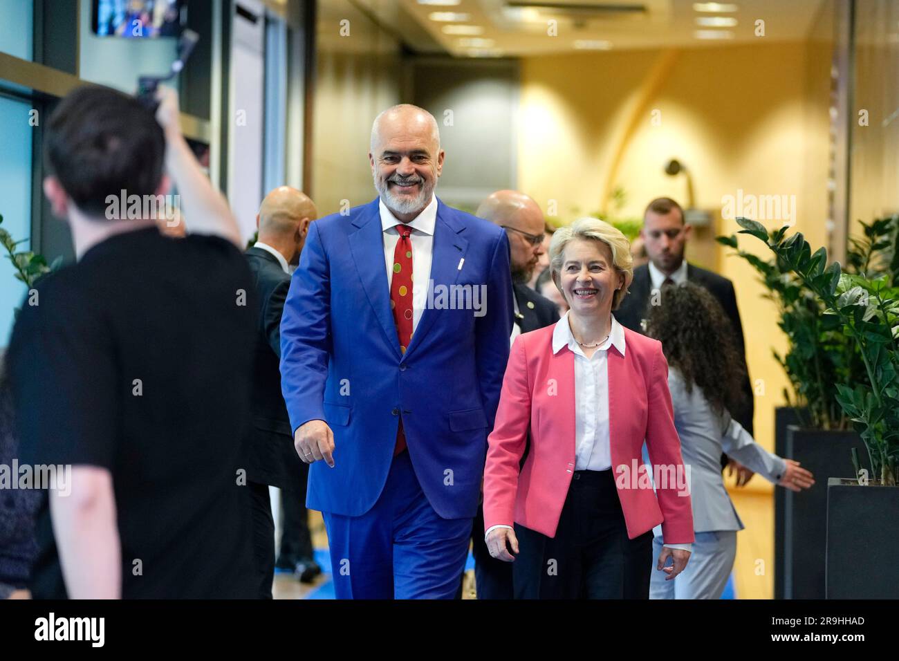 European Commission President Ursula von der Leyen, right, walks with ...