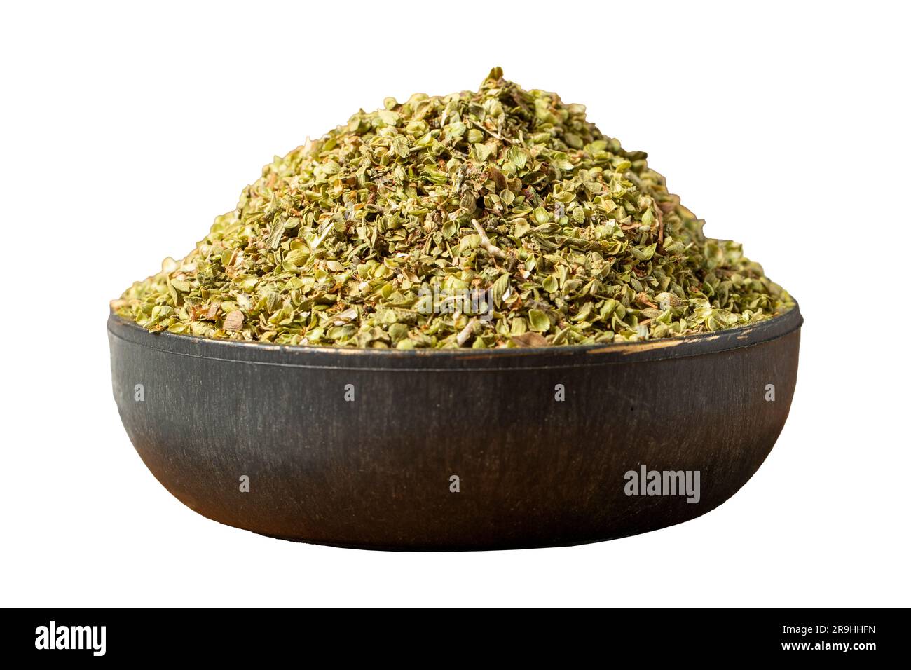 Dried thyme leaves. Thyme spice in a bowl isolated on white background. Dry spice concept. Close ...