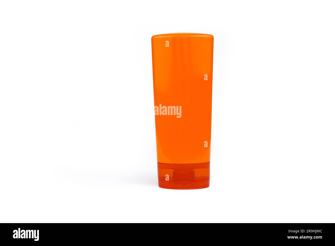 unbranded red shampoo or sunscreen cream bottle isolated on white ...