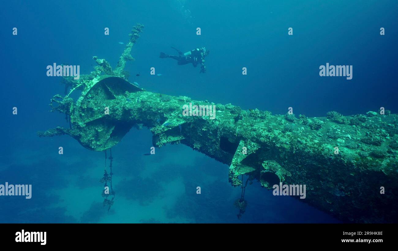 Scuba diver swim next to mast of ferry Salem Express shipwreck, Red sea ...