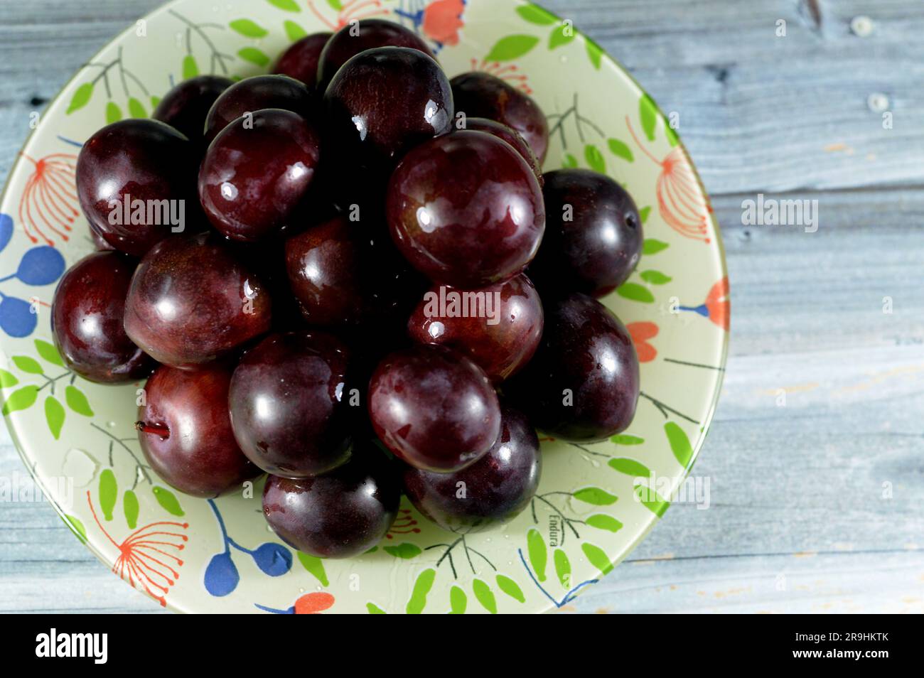 pile of plum fruit, A fruit of some species in Prunus subg. Prunus ...