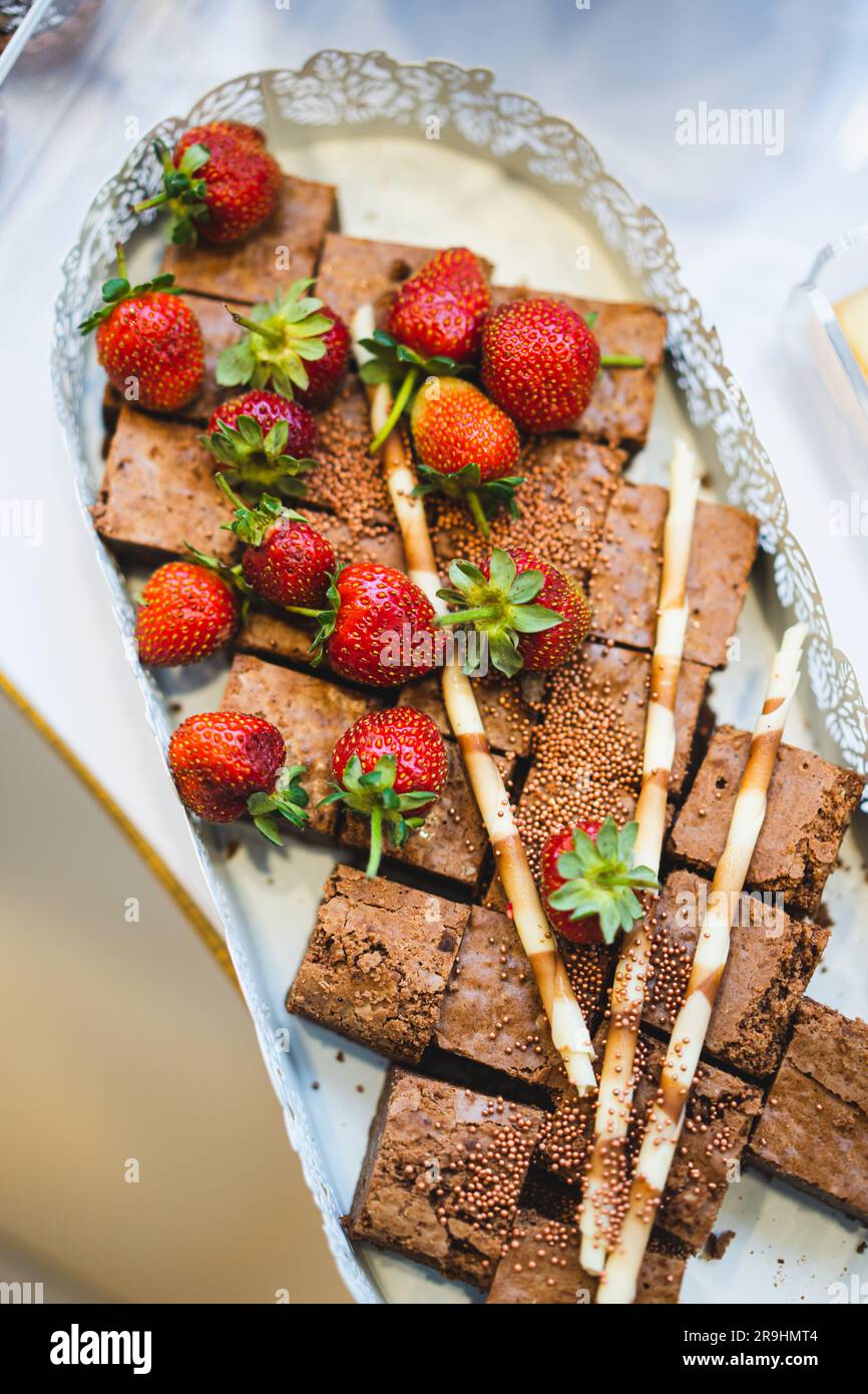 Delicious wedding reception candy bar dessert table with various sweets ...