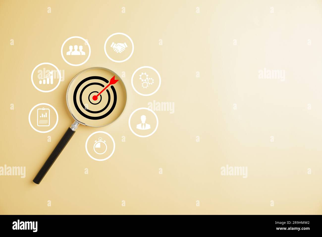 Target icon under magnifying glass Stock Photo - Alamy