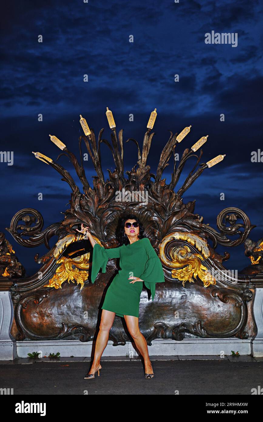 Paris by night, a Glamorous Middle Aged Asian Woman on Pont Alexandre ...