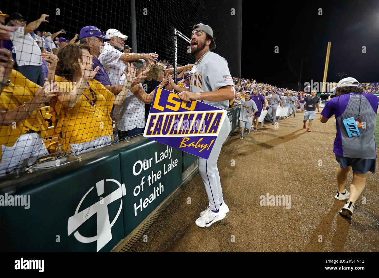LSU pitcher Blake Money celebrates with fans after their team defeated ...