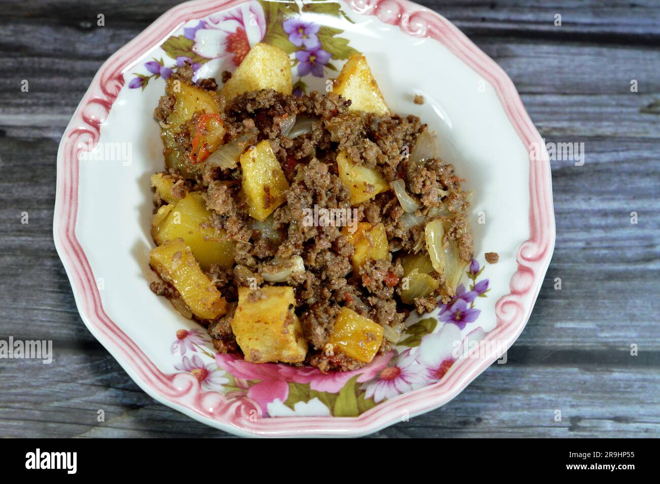 Egyptian cuisine of Fried potato cubes then cooked with minced beef ...