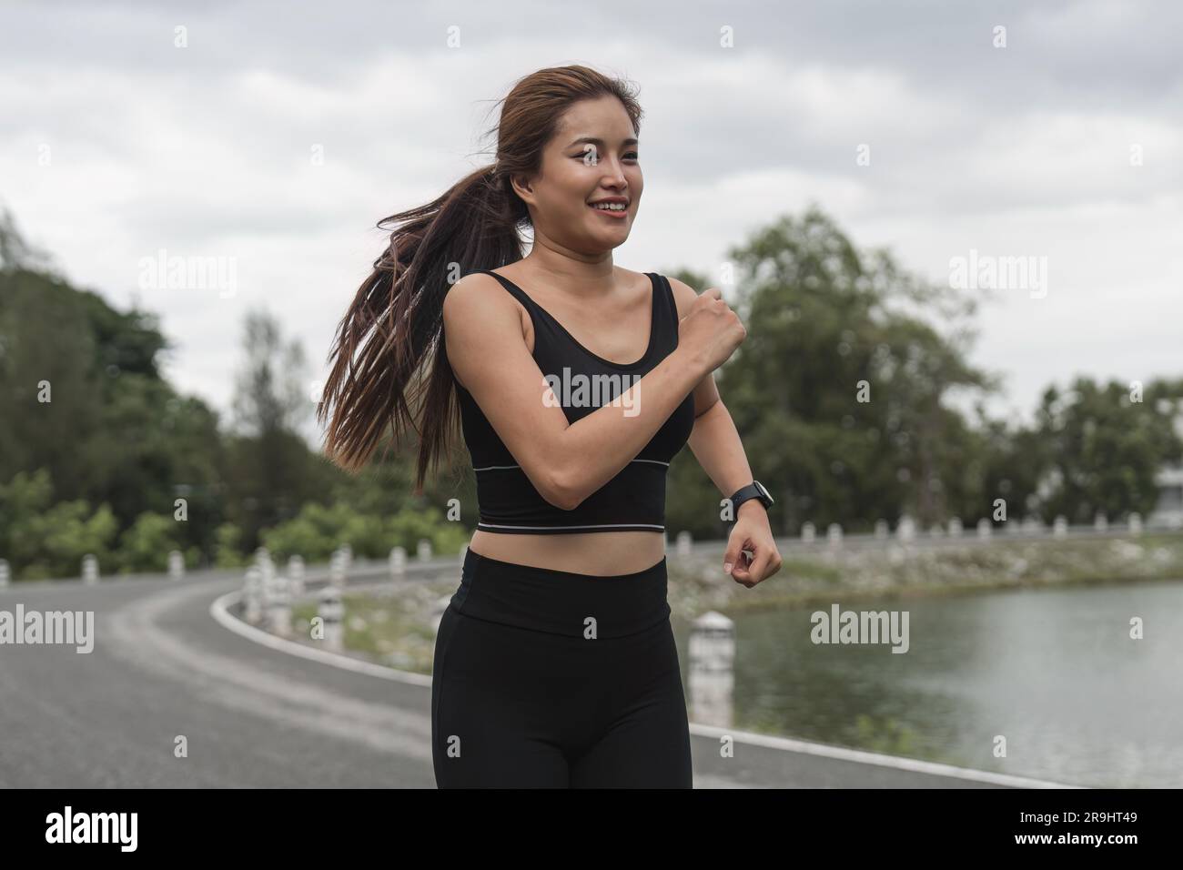 Jogging woman running in park on beautiful day off. Sport fitness model ...