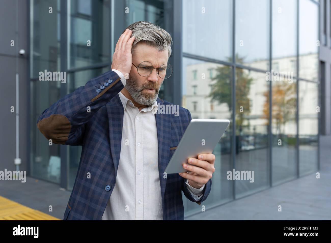 Mature gray haired boss businessman received message with bad news, man ...