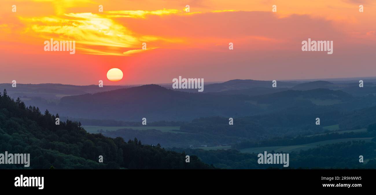 Sunset over the land of extinct volcanoes in Poland Stock Photo - Alamy