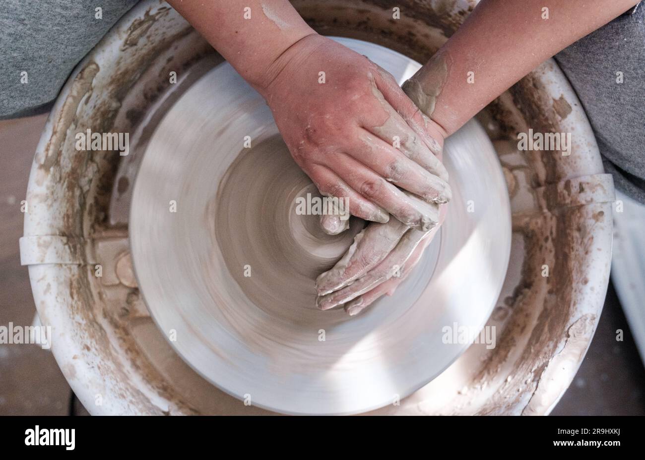 Top-down close up of a person working on pottery wheel. Pottery Concept ...