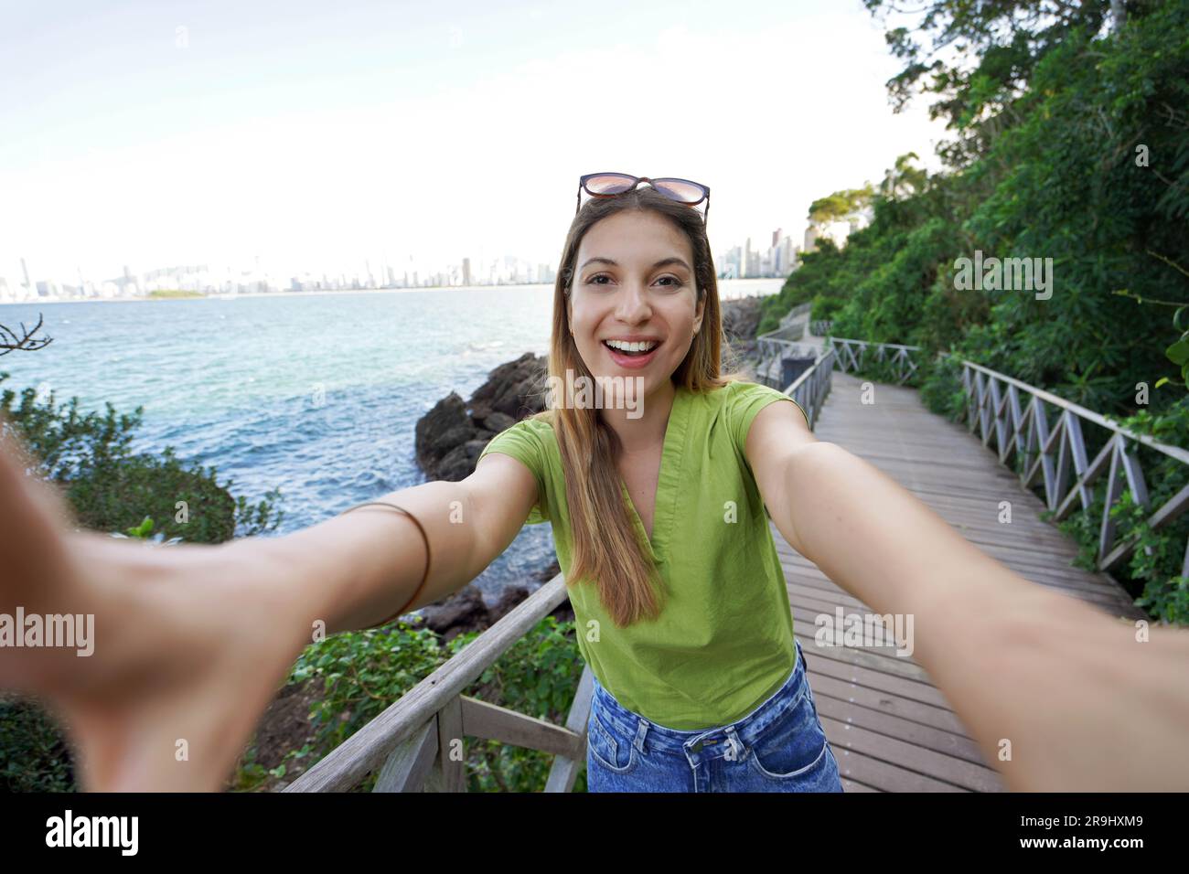 Cool fashion laughing girl takes self portrait in Balneario Camboriu ...