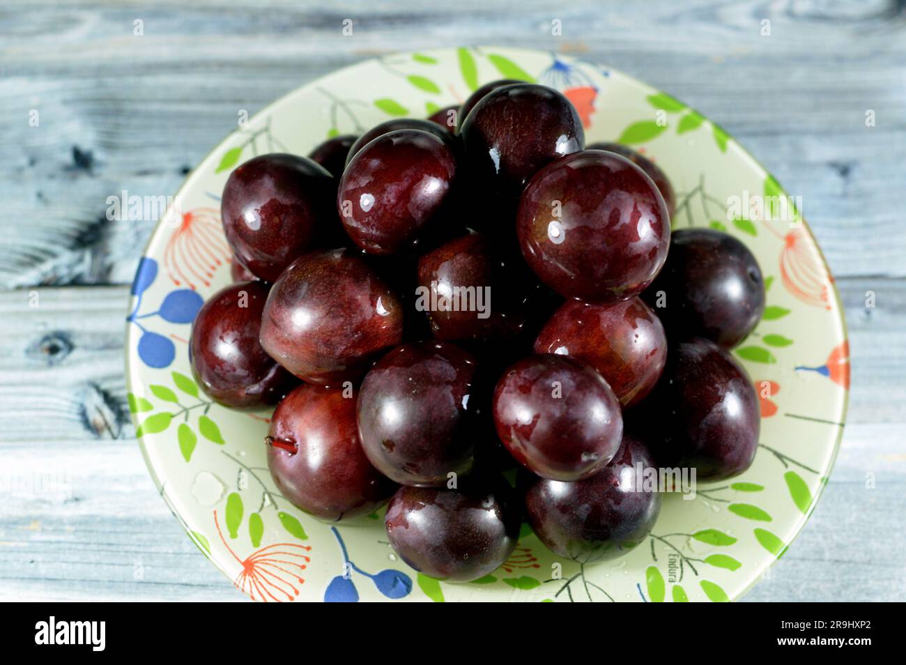 pile of plum fruit, A fruit of some species in Prunus subg. Prunus ...