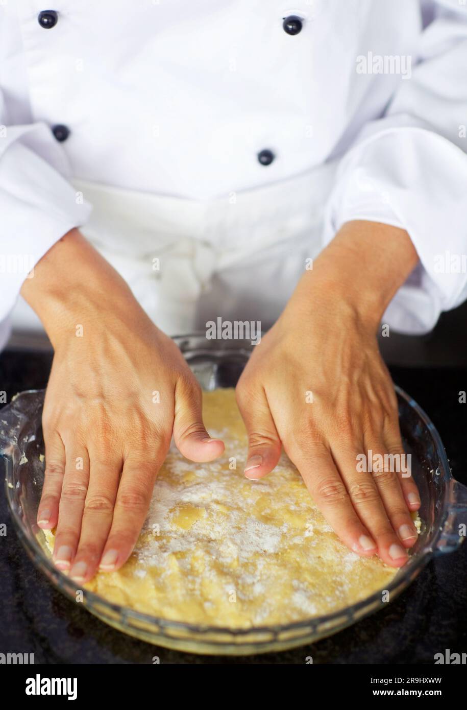 Baker, hands and press pie dough for dessert, cake or meringue in ...