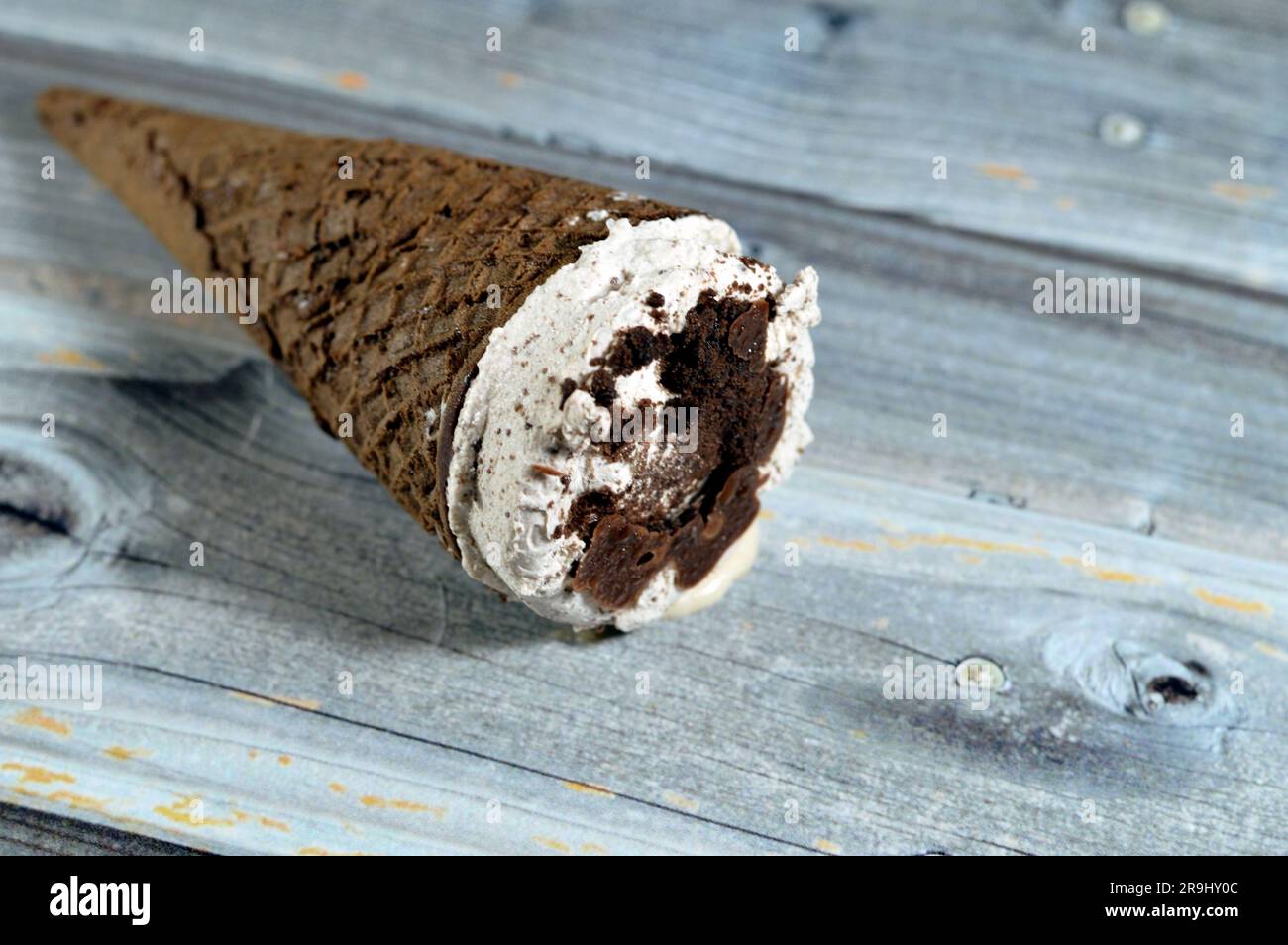 Ice cream of cocoa chocolate and vanilla cone with topping of chocolate ...