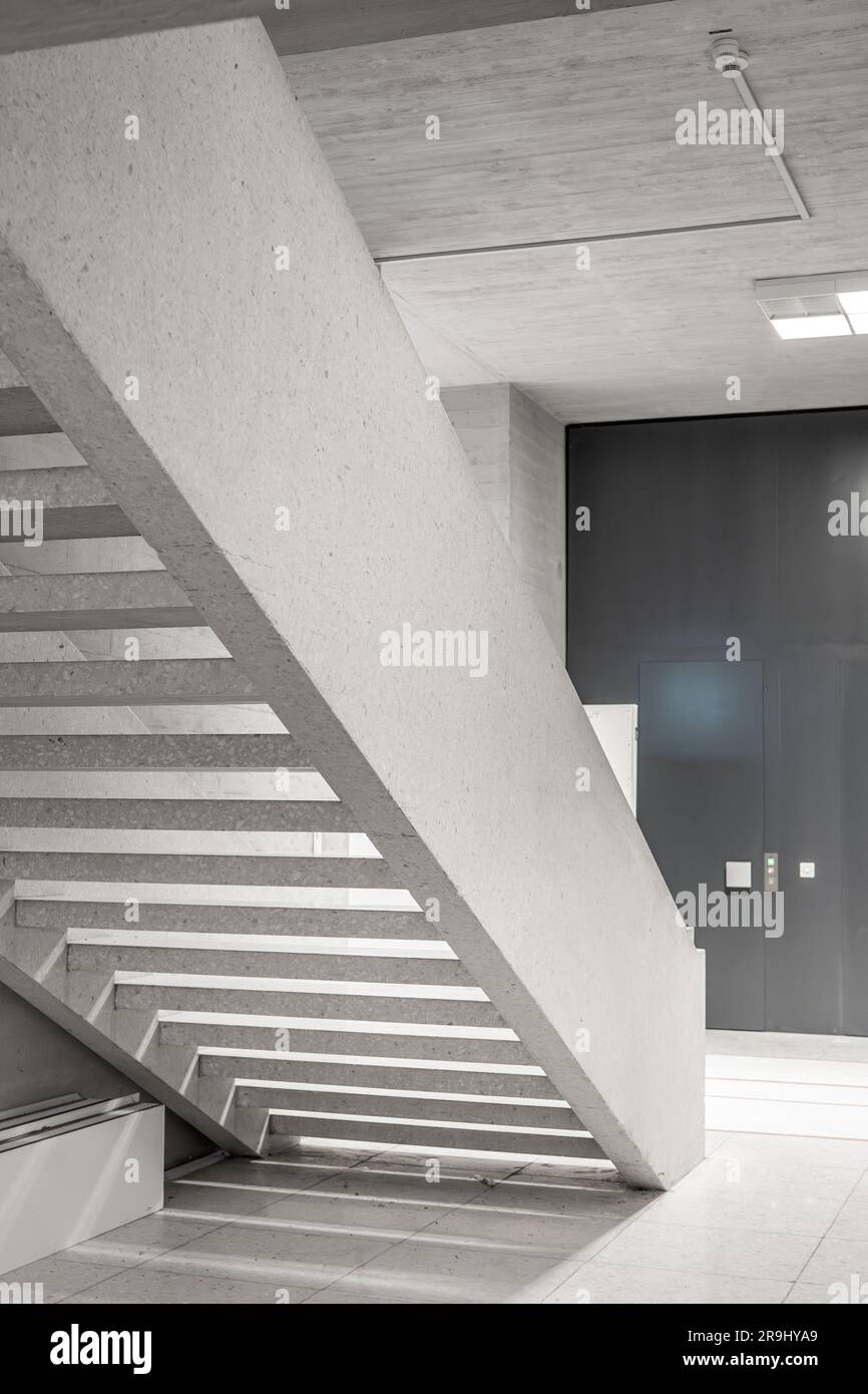 Concrete stairs in the hallway of an empty public access building ...