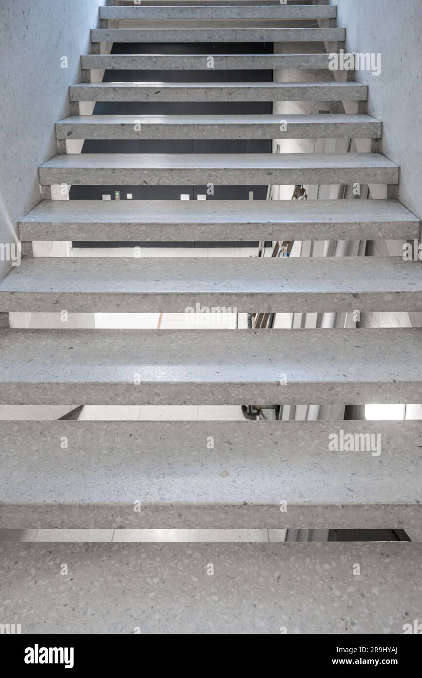 Concrete stairs in the hallway of an empty public access building ...