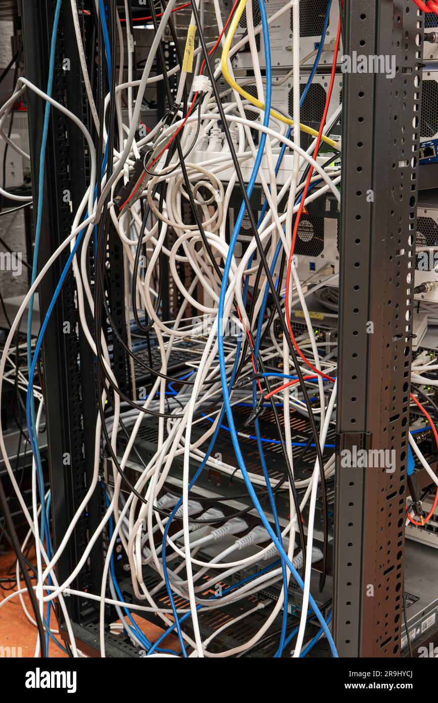 Messy tangled electric cables connecting to industrial lab devices on a rack, no people Stock ...