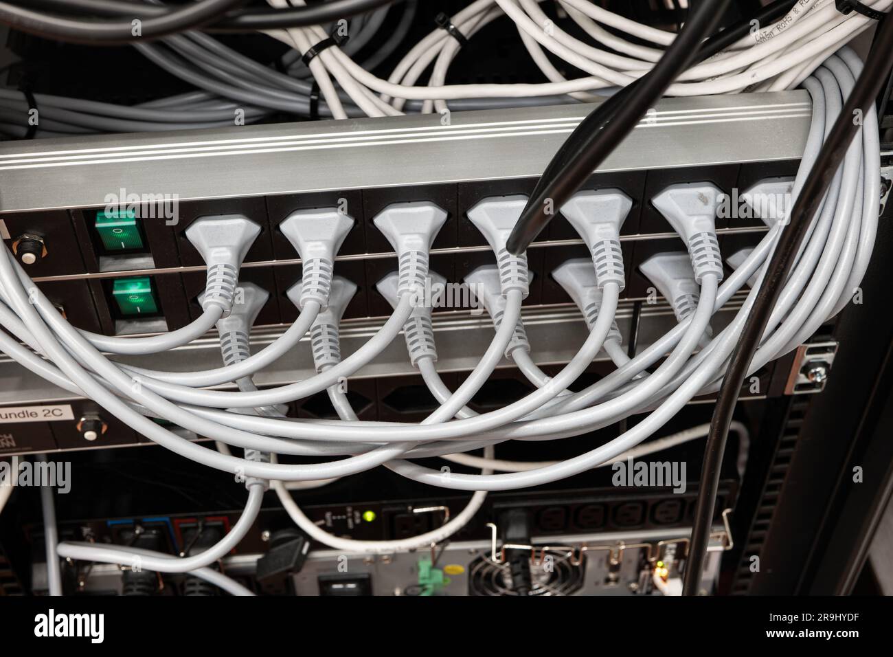 Neatly organized power cord extension cables with fully used plugs on ...