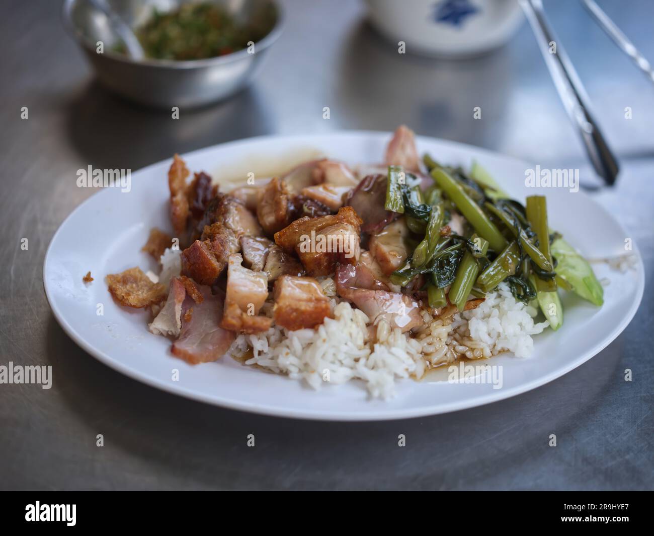 Barbecued red pork and crispy pork in sauce with rice Stock Photo - Alamy