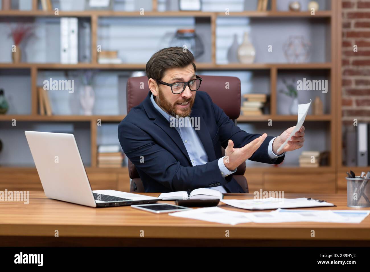 Angry displeased boss arguing and yelling at colleagues online on video ...
