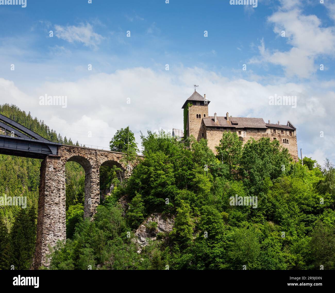 Summer alpine Trisanna railroad bridge over Trisanna river and ...