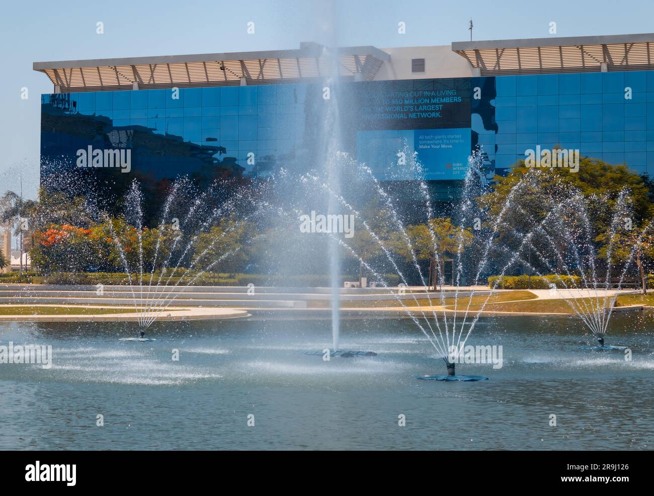 Fountain in front of glass building Stock Photo - Alamy