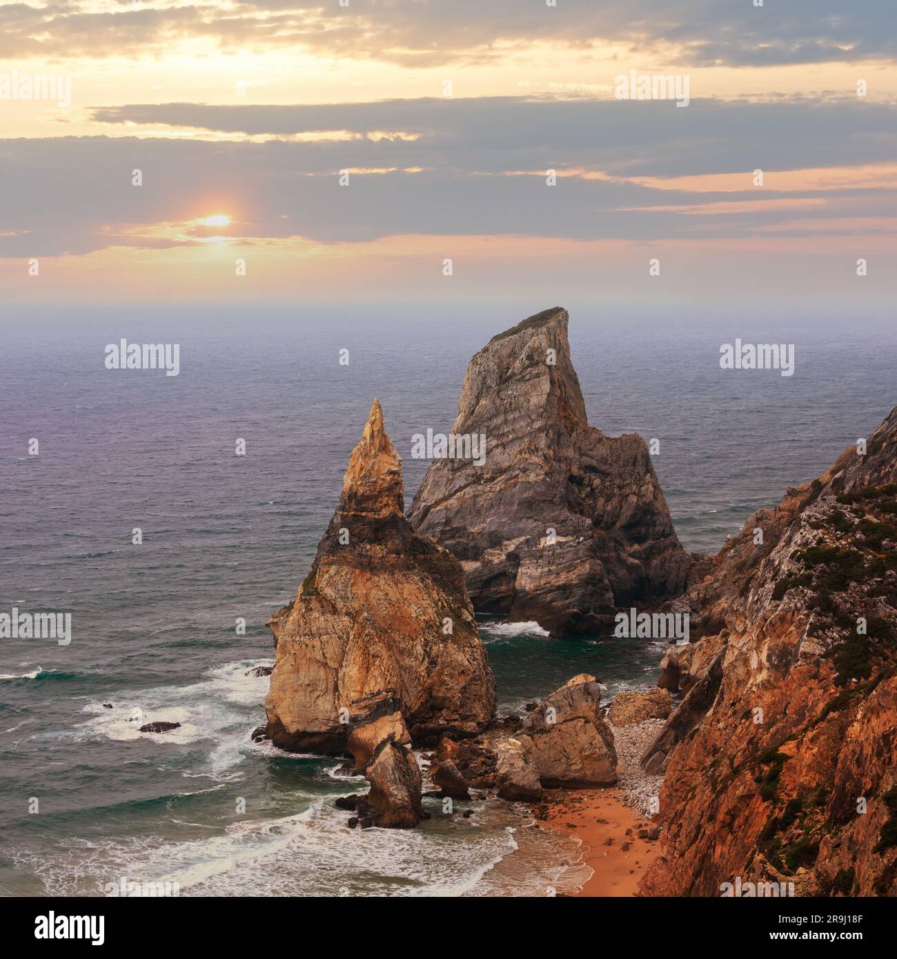 Atlantic ocean coast (granite boulders and sea cliffs) in cloudy ...