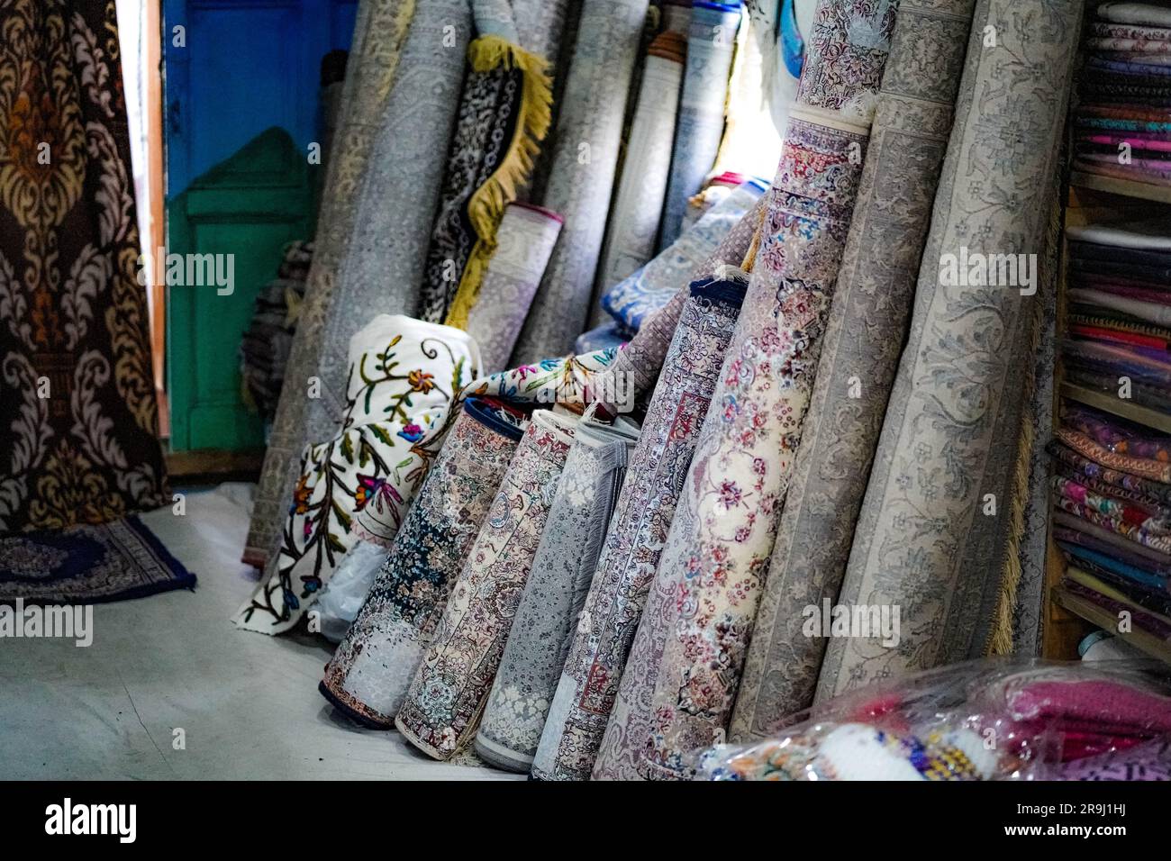 A collection of Kashmiri Carpets rolled for sale Stock Photo - Alamy