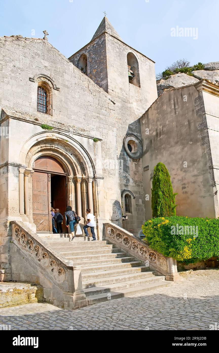 The medieval stone facade of St Vincent church with carved arched ...