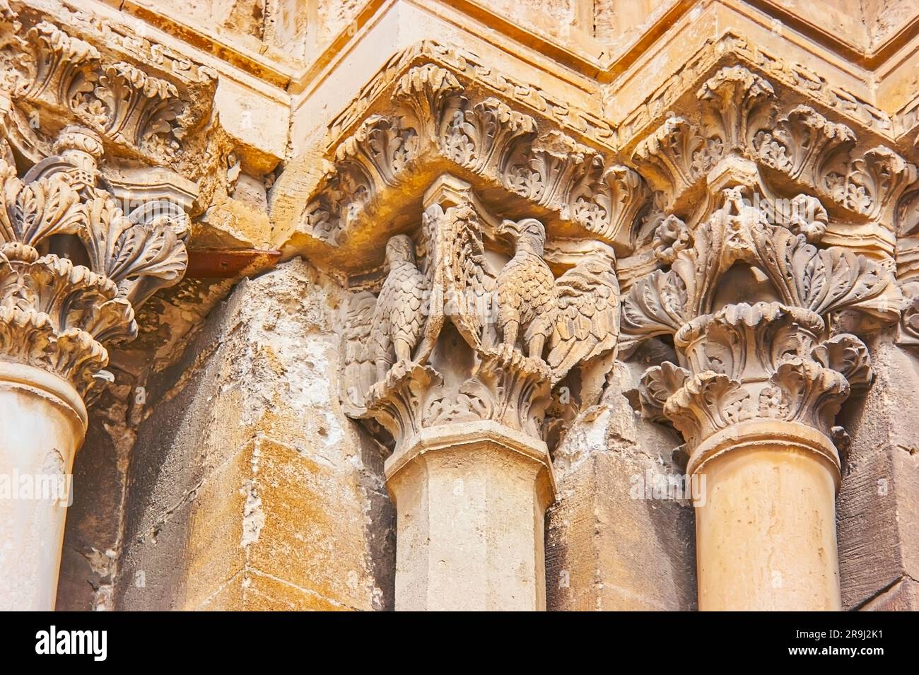 The ornate carved Romanesque capitals of columns of the Southern portal ...
