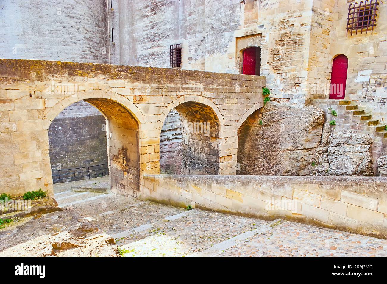 The massive arched stone bridge of the Tarascon Castle, France Stock ...