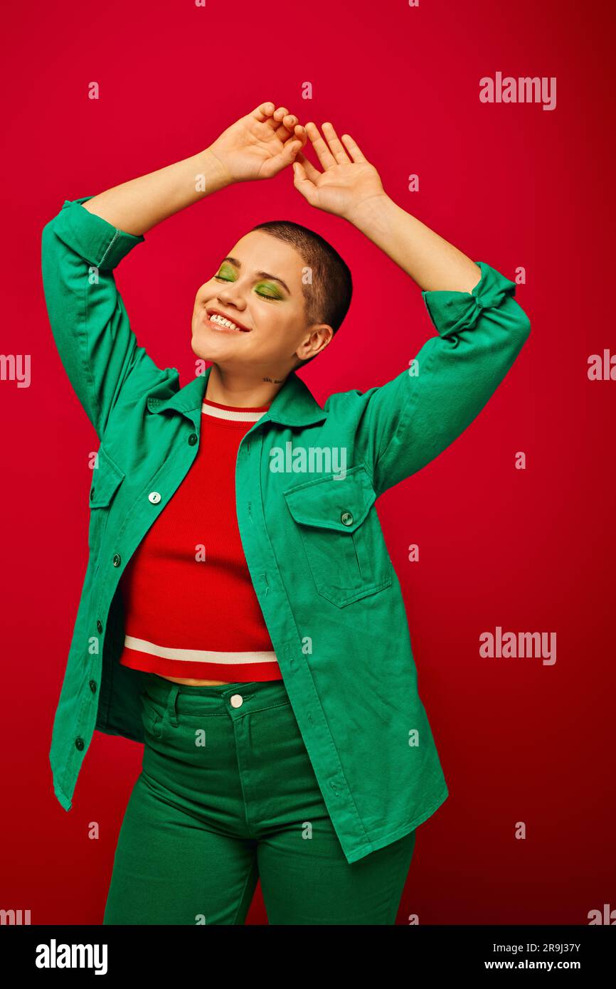 fashion and style, happy and short haired woman in green outfit posing ...