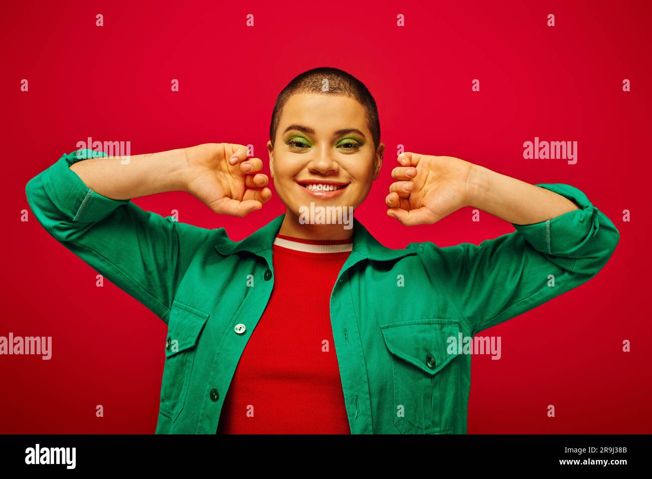 fashion statement, cheerful and short haired woman in green outfit ...