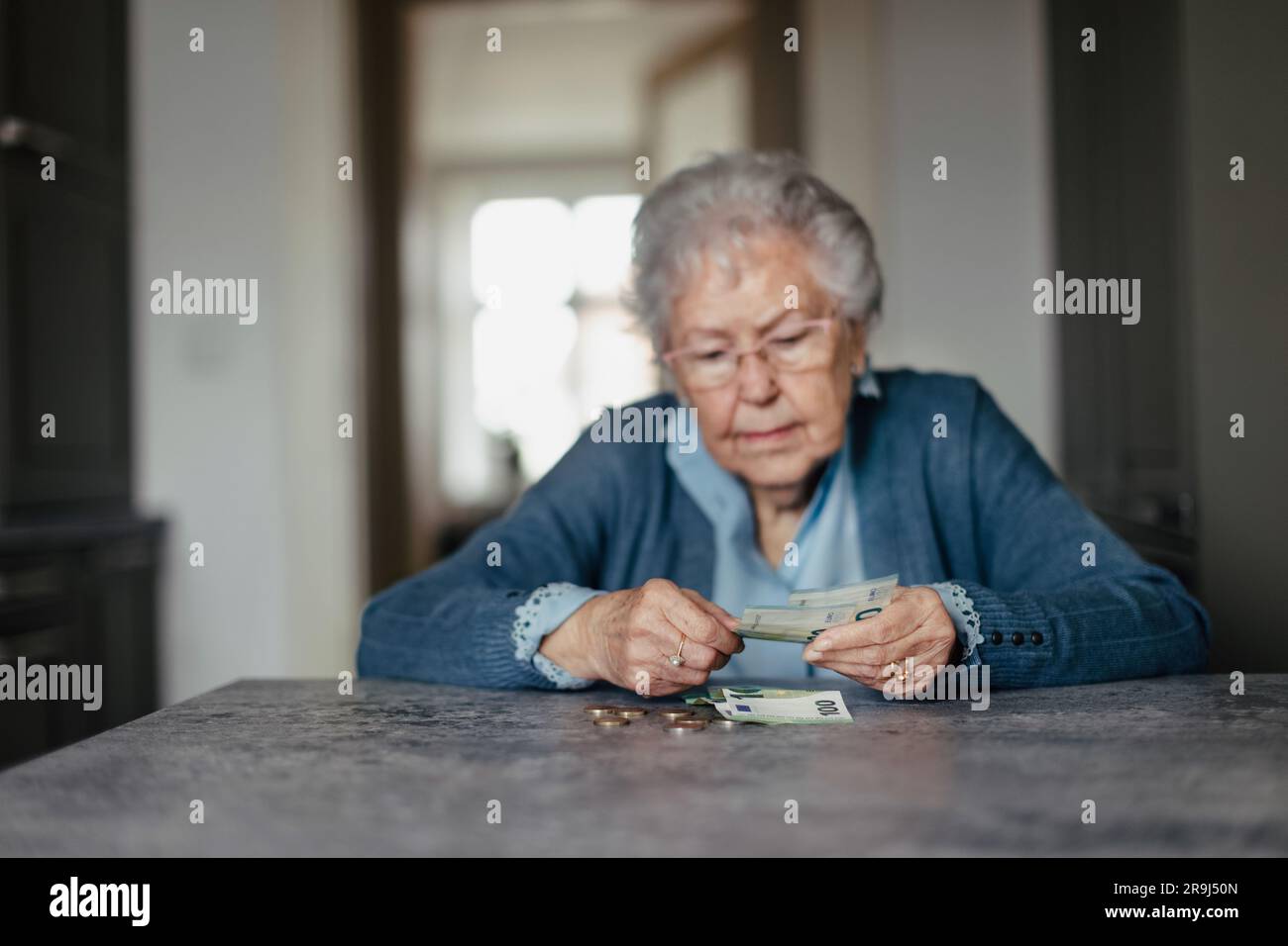 Mature woman money purse hi-res stock photography and images - Alamy