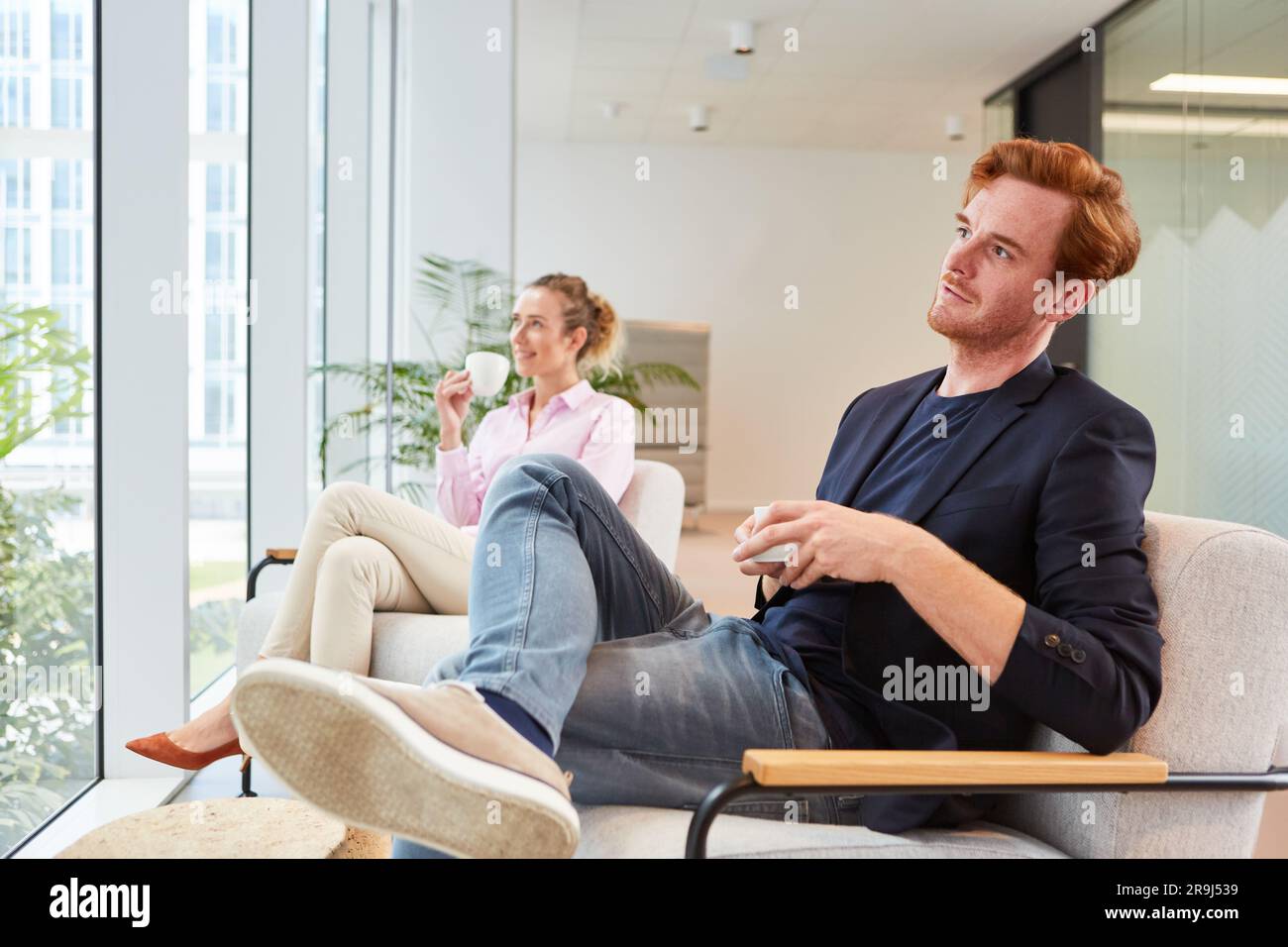 Businessman sitting in office lounge hi-res stock photography and ...