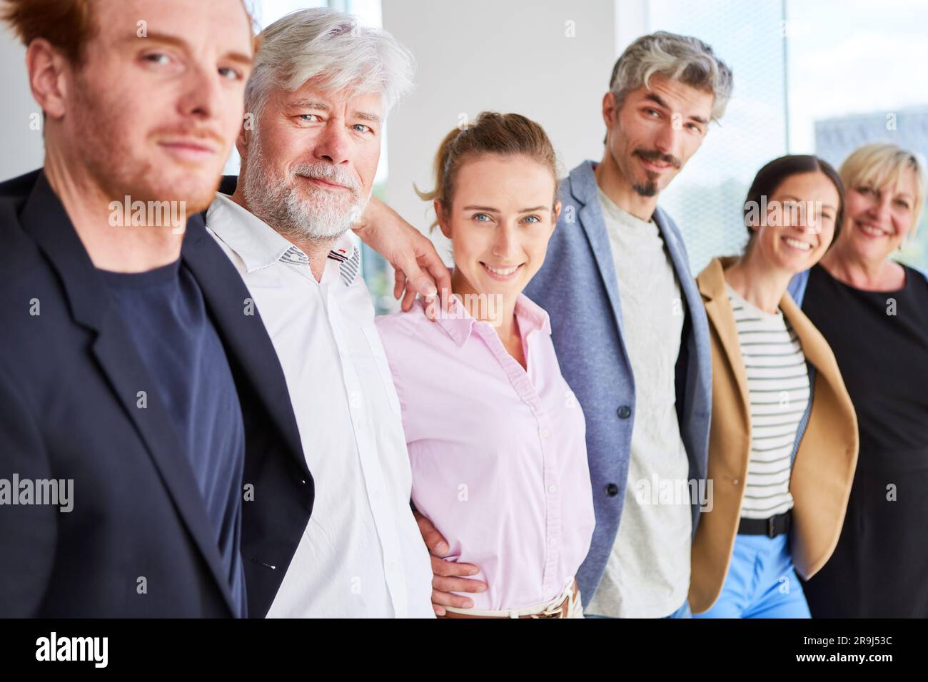 Company employees standing together hi-res stock photography and images ...