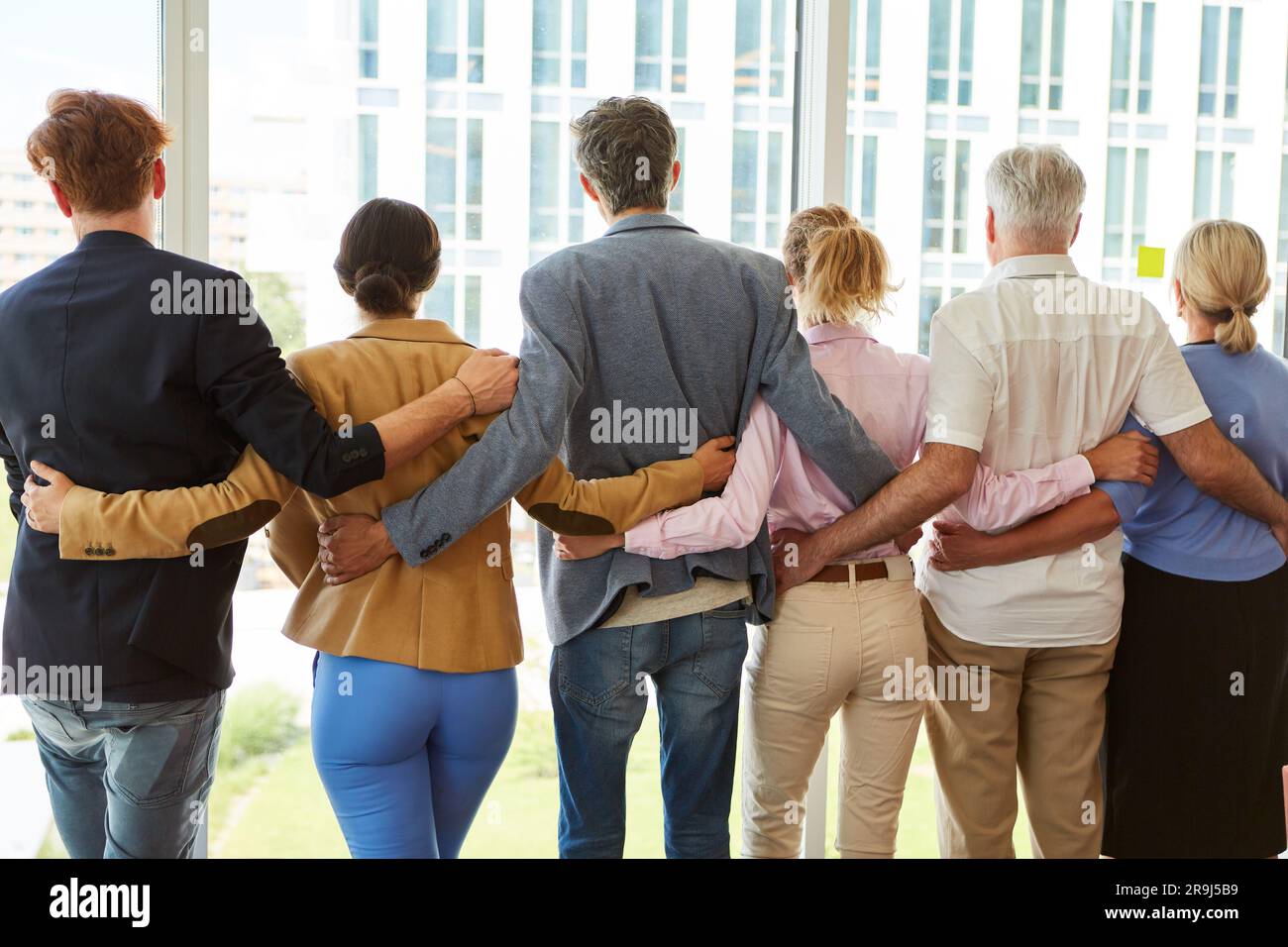 Group of men standing around hi-res stock photography and images - Alamy