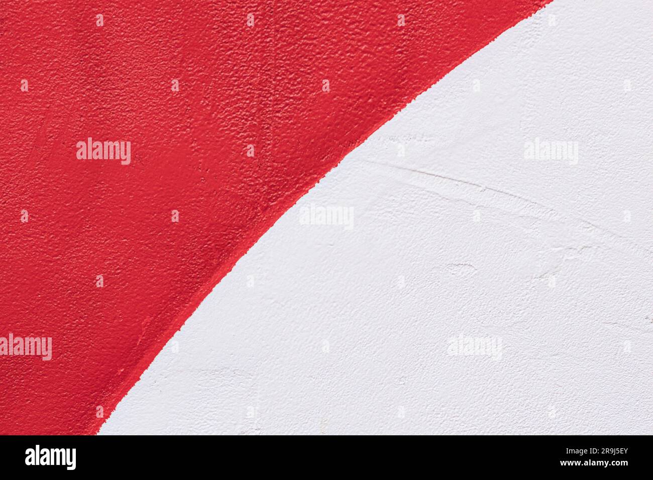 Abstract fragment of wall with detail of graffiti, old chipped paint ...