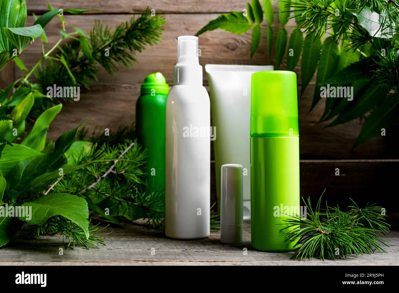 Mosquito repellents and sprays anti stinging insects on wooden ...